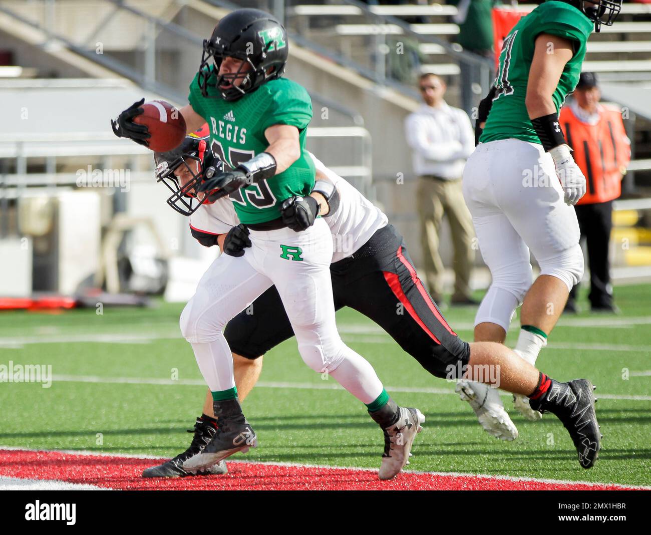 Eau Claire Regis' Caleb Brickner (25) scores a touchdown against ...