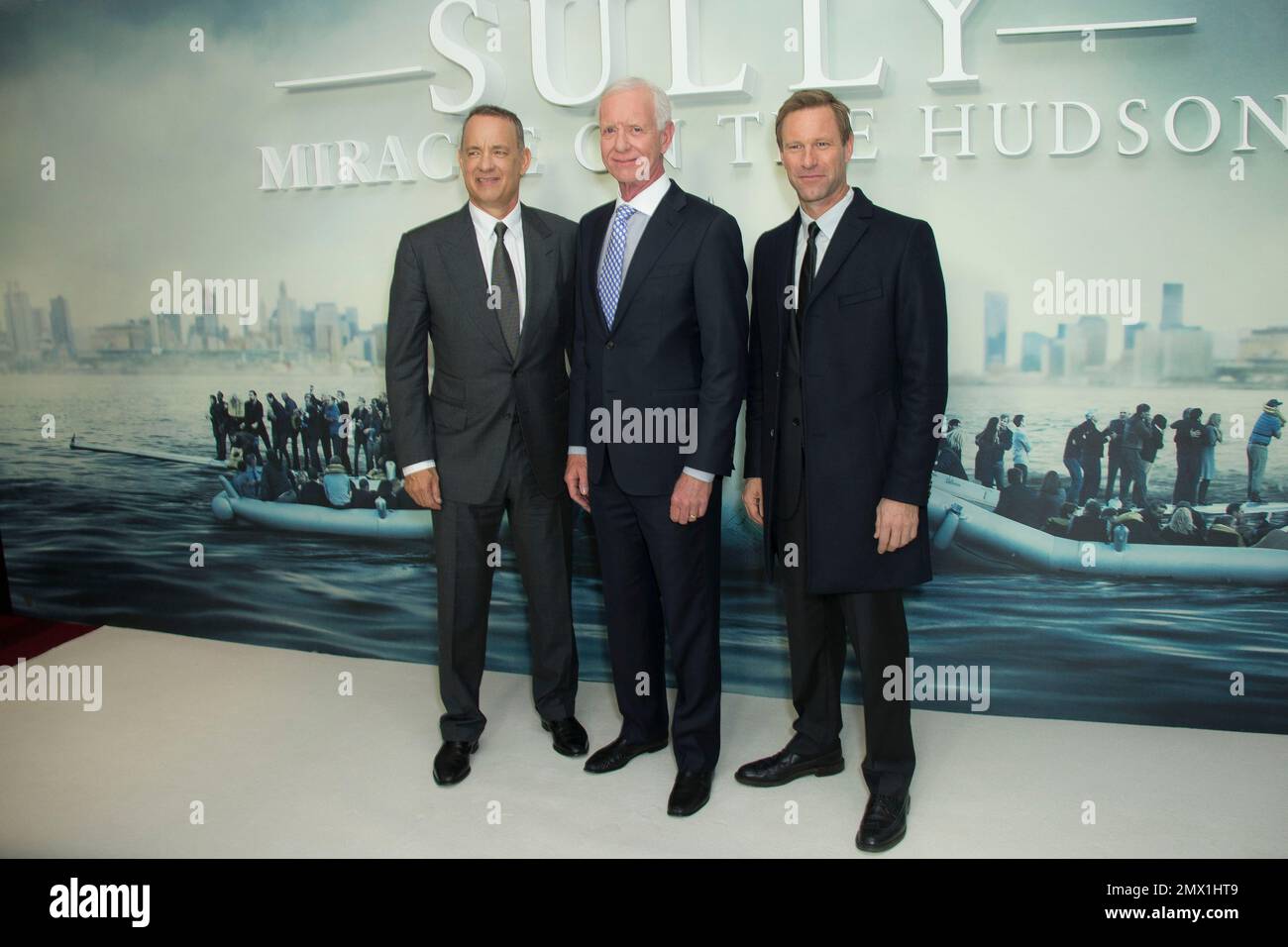 Actors Tom Hanks, left and Aaron Eckhart, right, pose for photographers ...