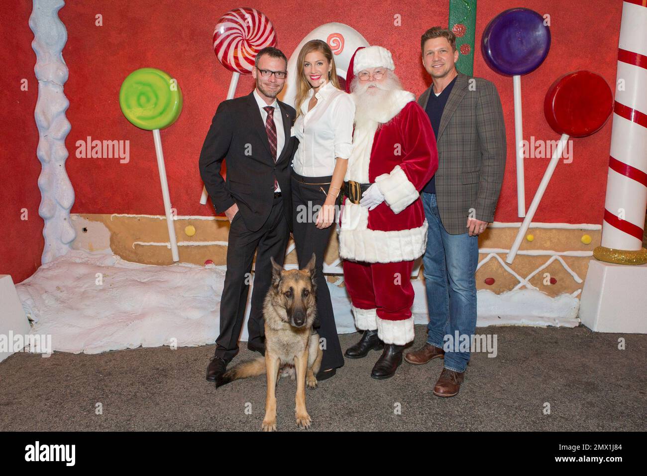 Captain Jason Haag with service dog Axel, from left, Tricia Helfer and ...