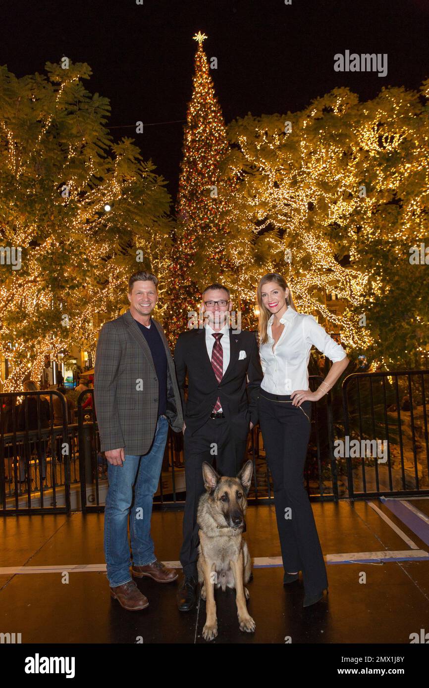 Marc Blucas, from left, Captain Jason Haag, service dog Axel and Tricia ...
