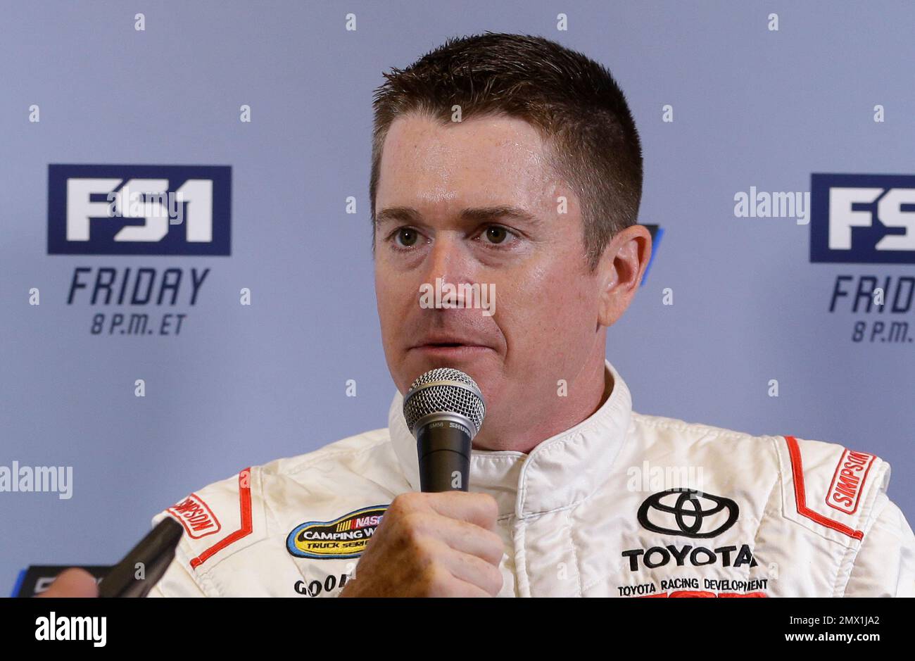NASCAR Camping World Truck Series driver Timothy Peters talks to a ...