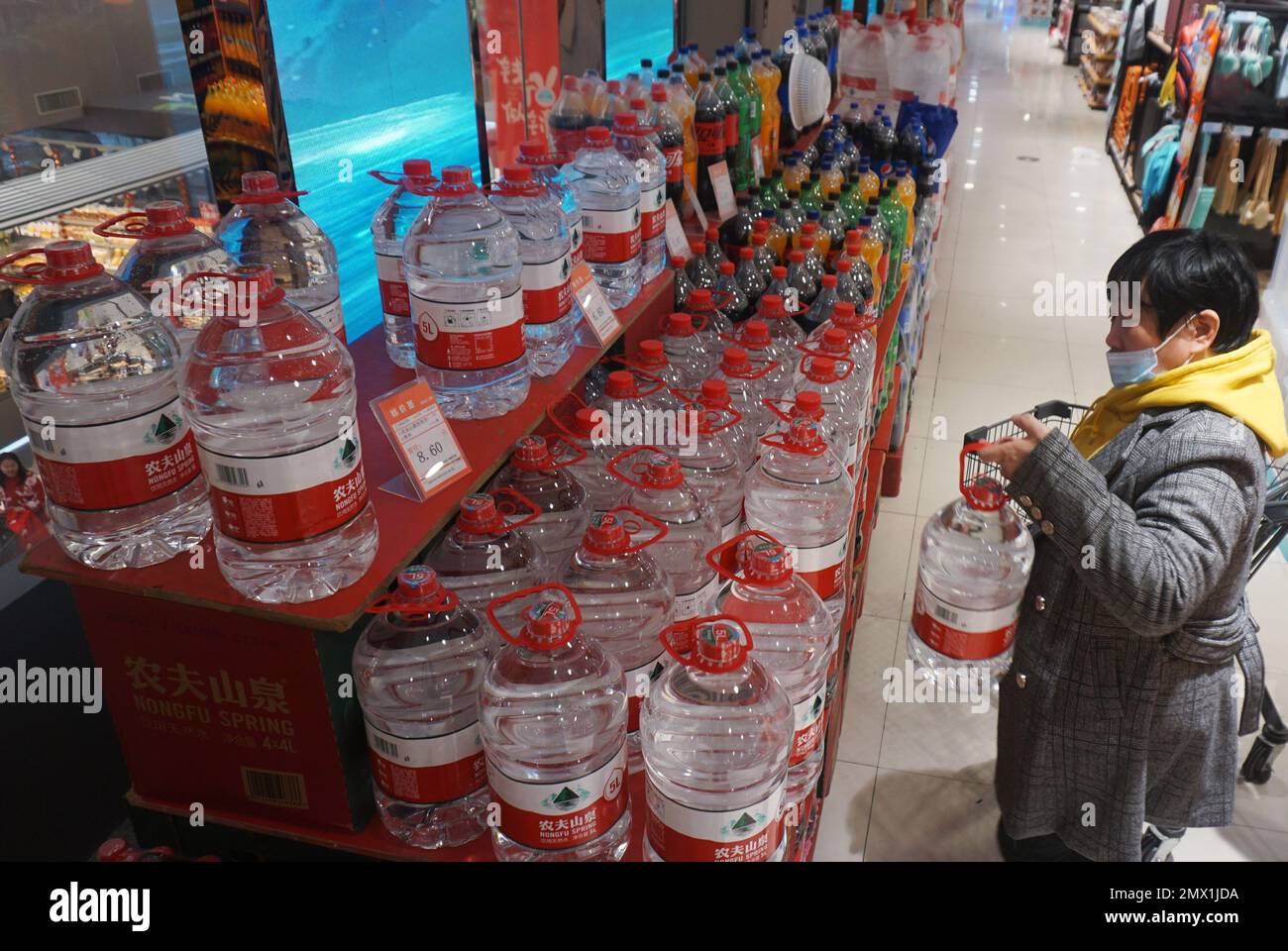 HANGZHOU, CHINA - FEBRUARY 2, 2023 - A citizen buys Nongfu Spring ...