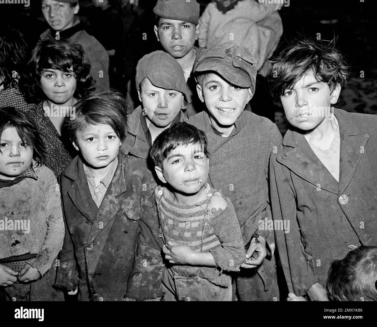 Romani children in tattered clothing in a Gypsy camp in Marburg ...