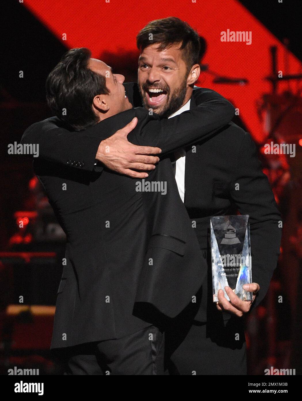Honoree Marc Anthony, left, accepts the award for the Latin Recording ...