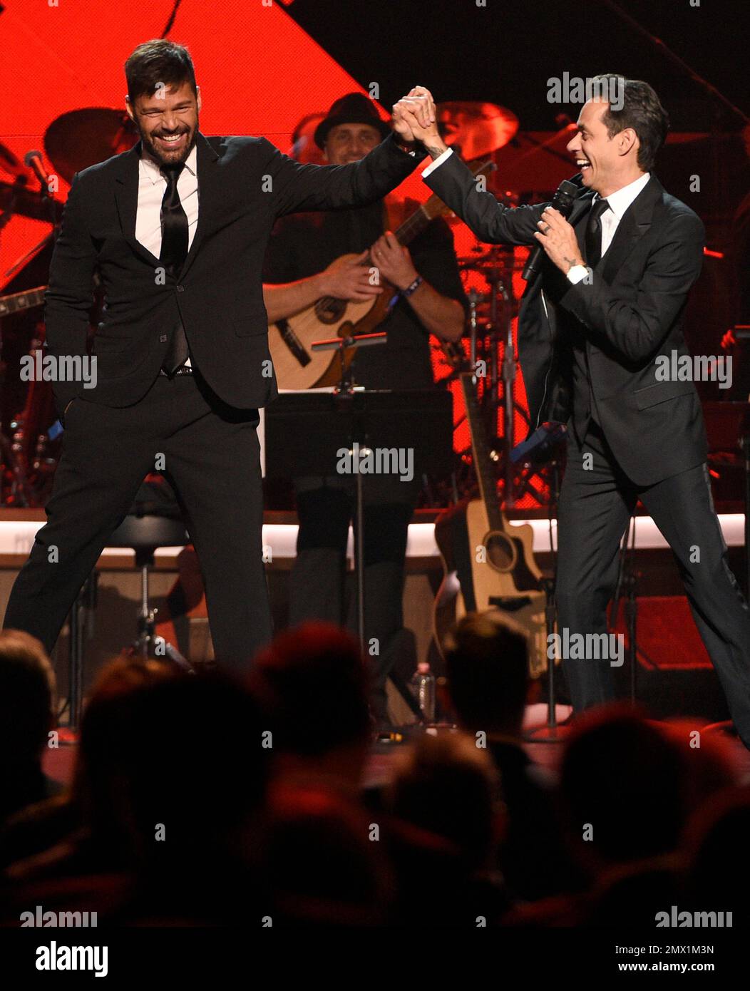 Honoree Marc Anthony, right, accepts the award for the Latin Recording ...