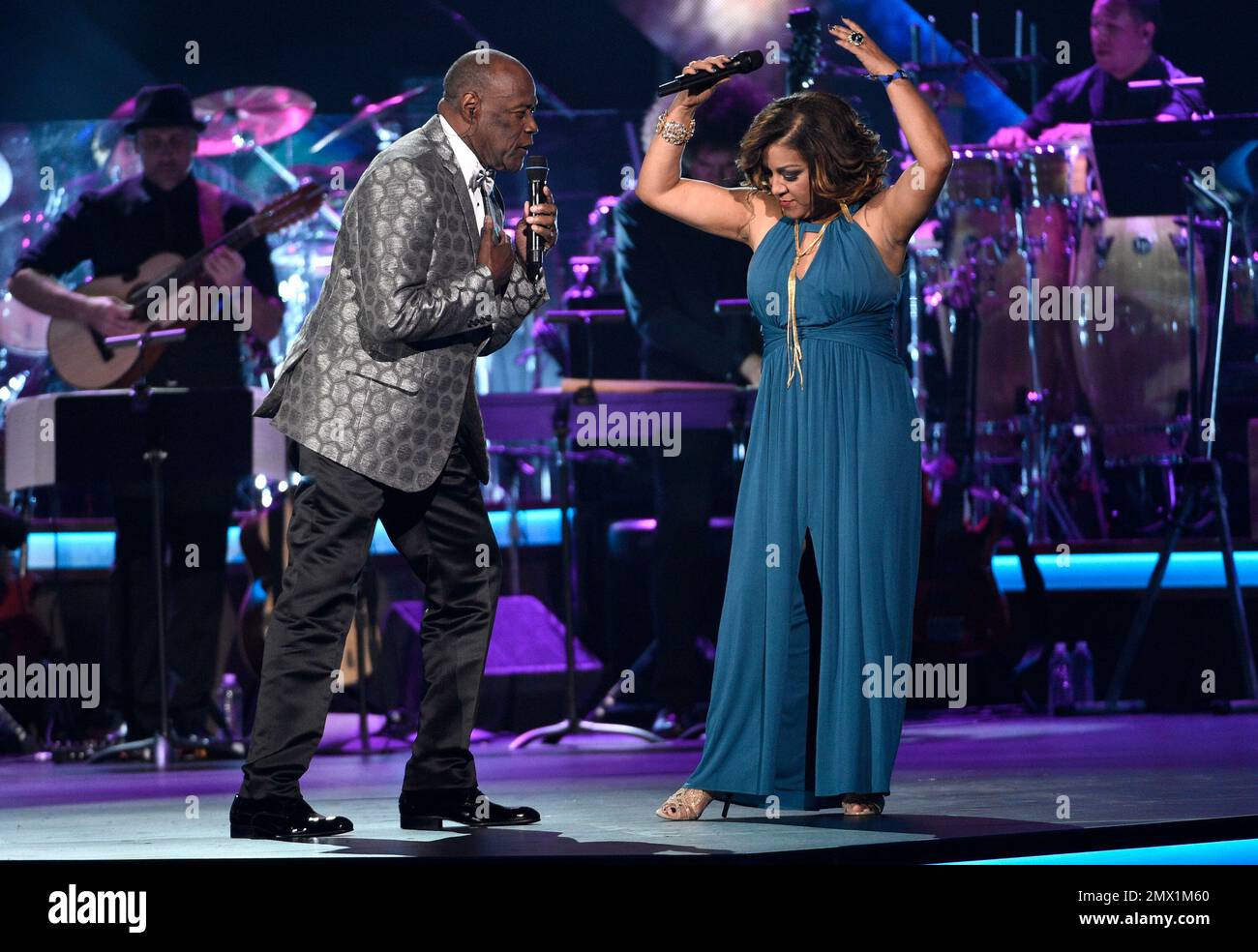 Johnny Ventura, left, Milly Quezada perform "Tu Amor Me Hace Bien" at ...