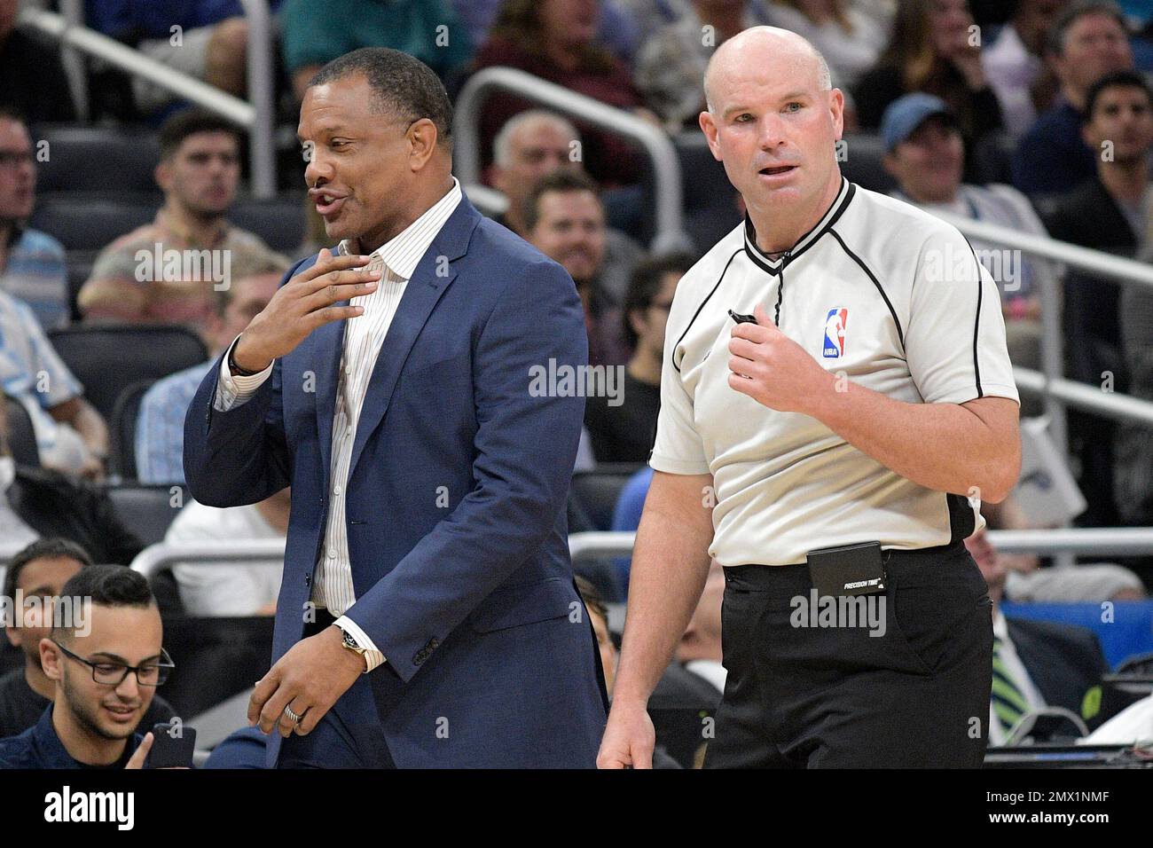 New Orleans Pelicans head coach Alvin Gentry, left, argues a call with ...