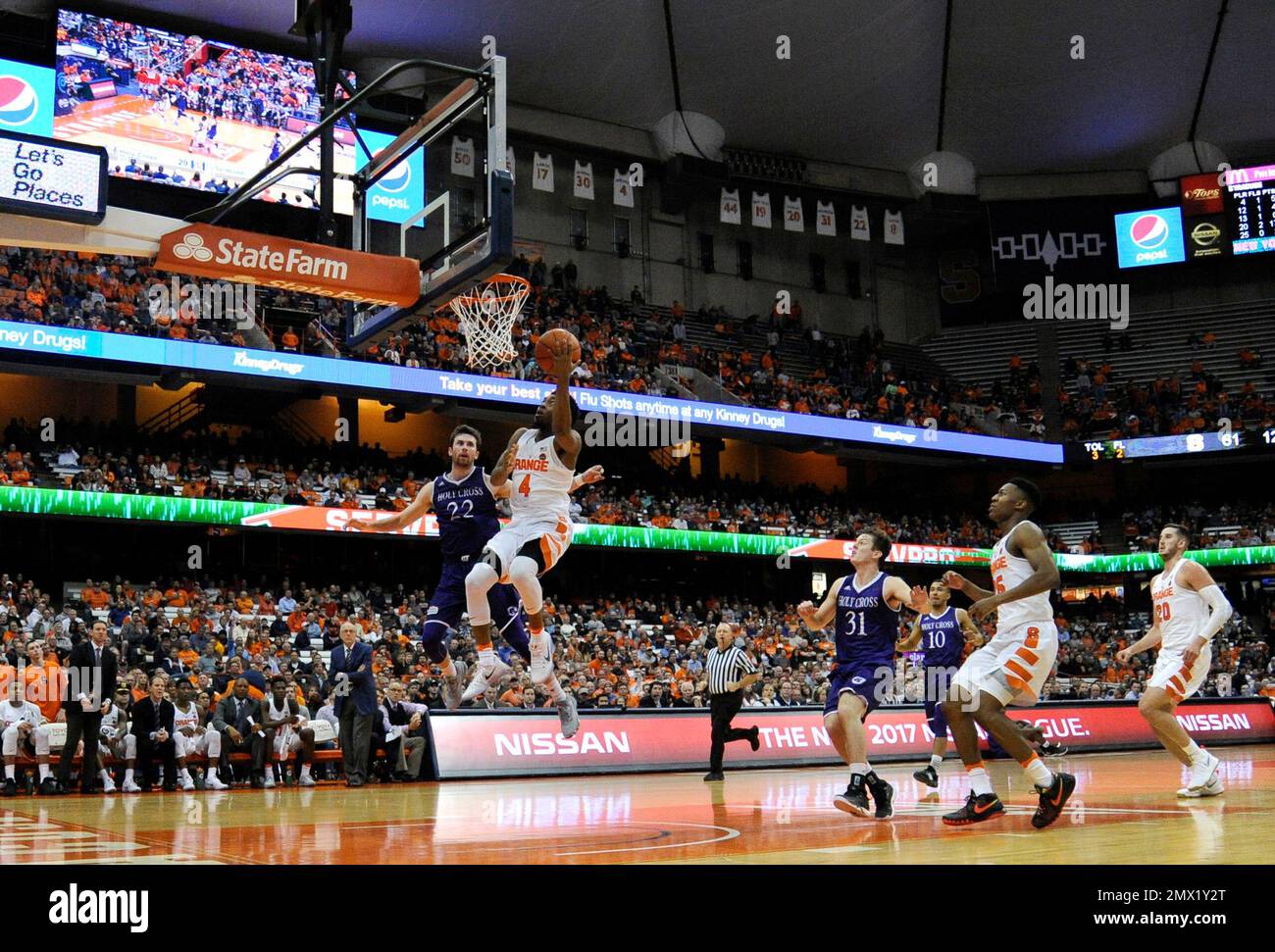 Syracuse guard John Gillon drives to the basket against Holy Cross ...