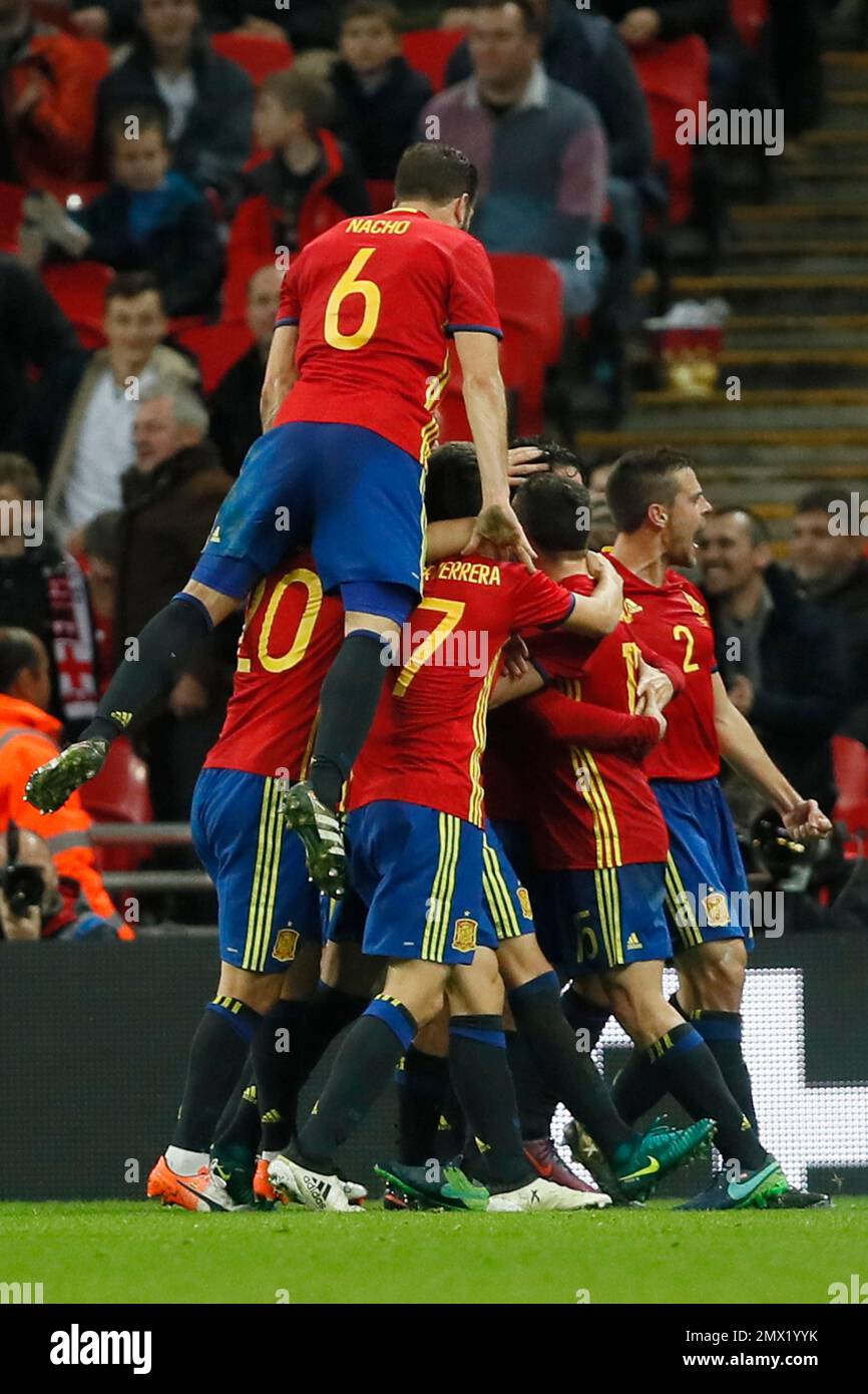 Spain players celebrate after scoring 2-2 during the international ...