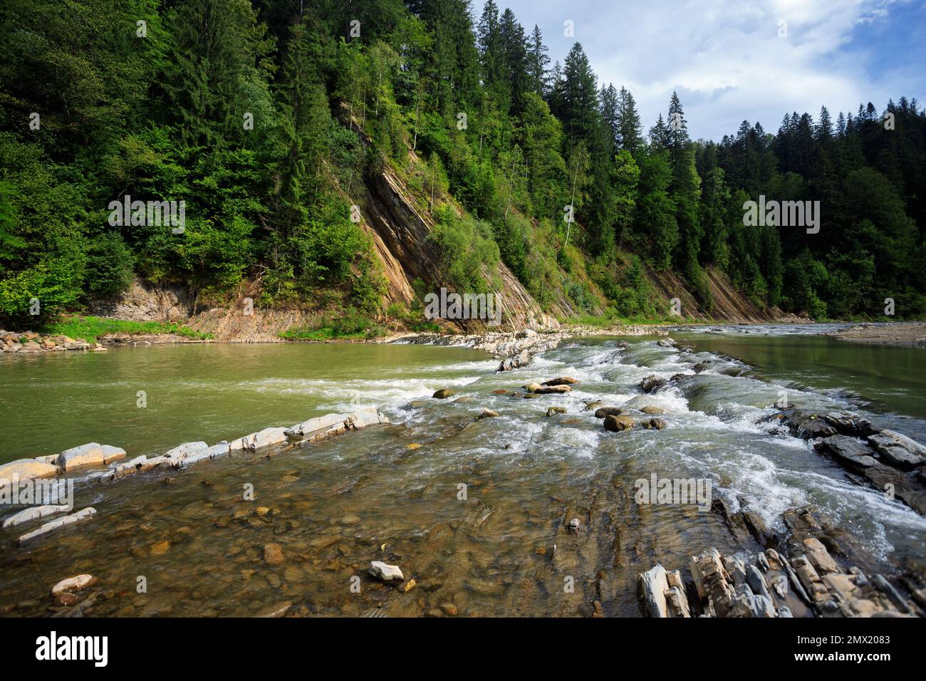 Threshold of a mountain river, among mountains and trees Stock Photo ...