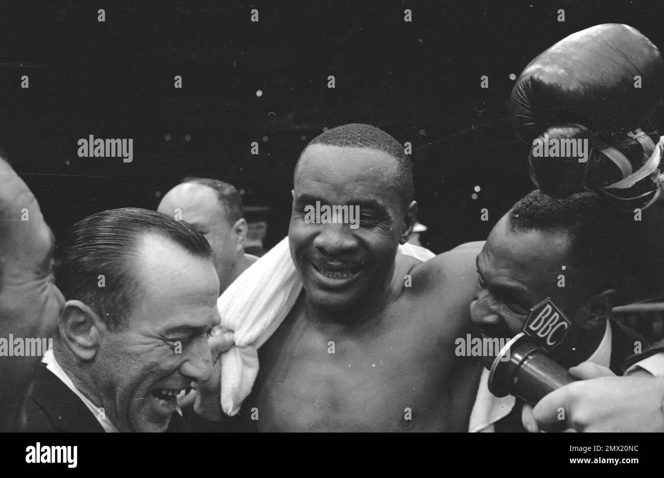 Exuberant handlers crowd around as Sonny Liston, new world heavyweight ...
