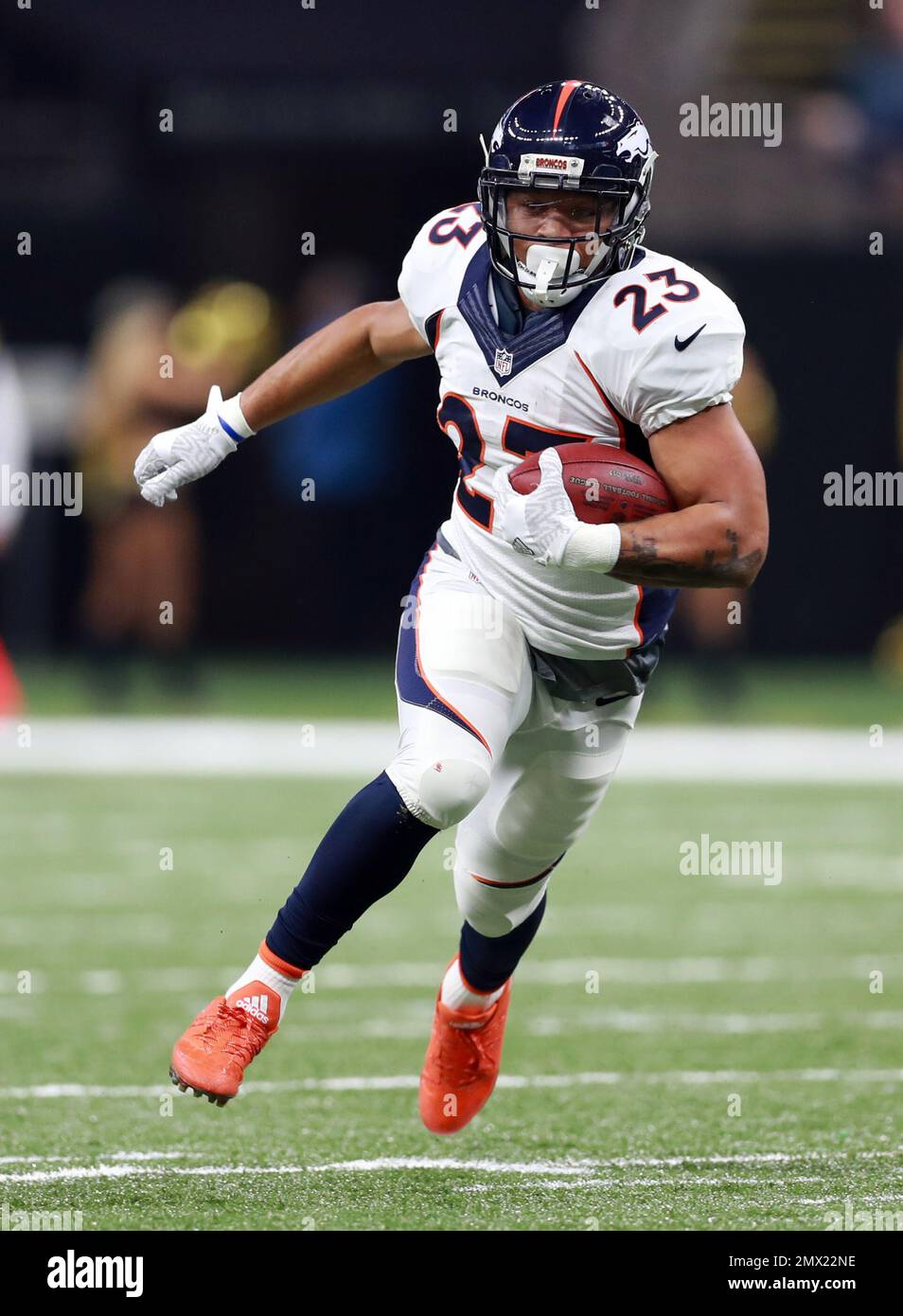 Denver Broncos running back Devontae Booker (23) runs with the ball ...