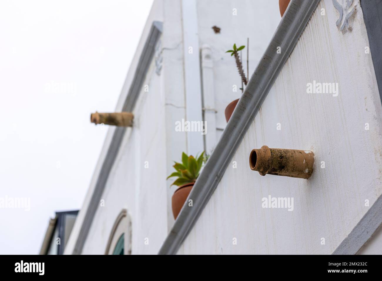 Traditional water drainage system on house made of ceramic Stock Photo ...