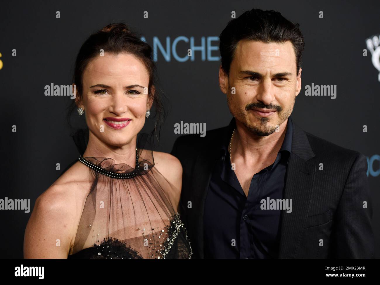 Actress Juliette Lewis, left, poses with drummer Brad Wilk at the ...