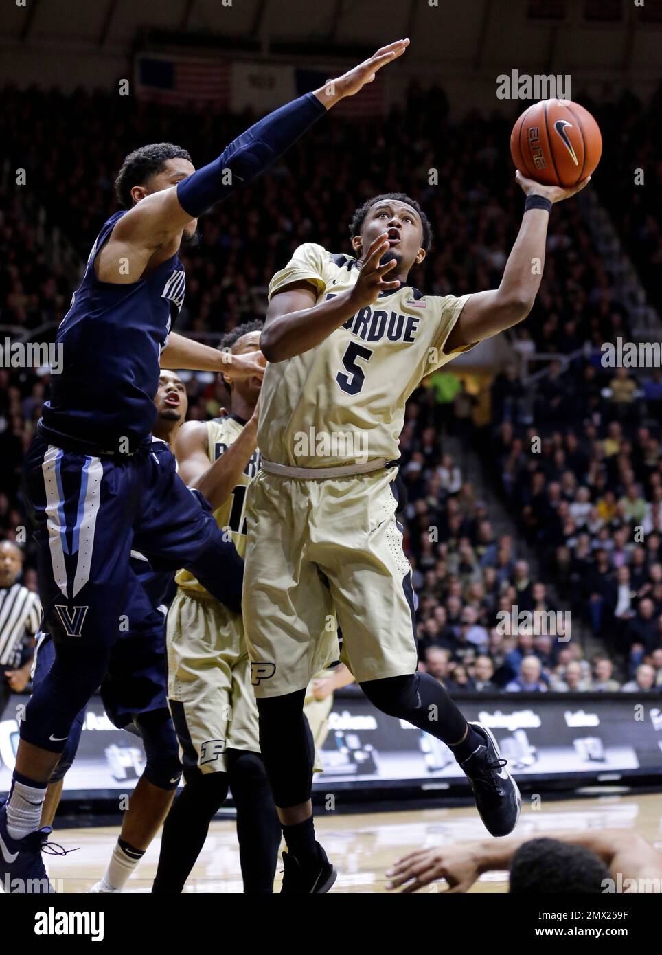Purdue forward Basil Smotherman (5) is fouled as he shoots by Villanova ...