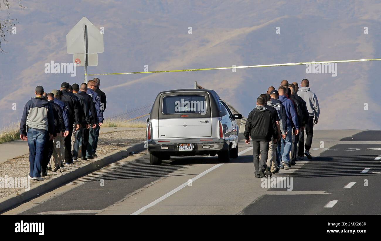 FILE - This Nov. 6, 2016, file photo, officers and colleagues walk with ...