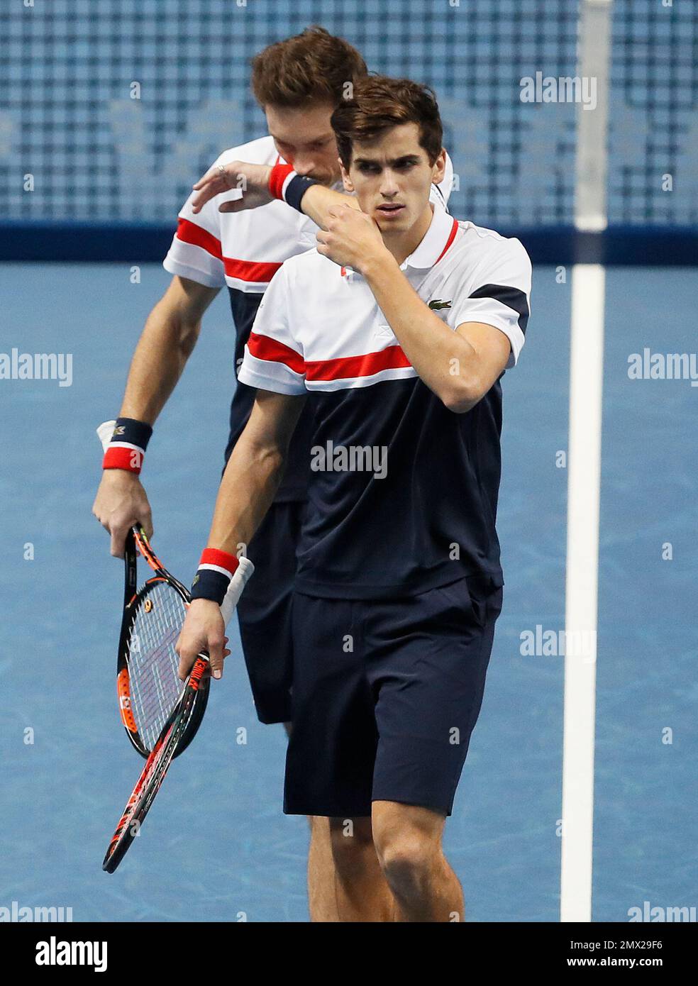 Pierre-Hughes Herbert, right, and Nicholas Mahut both of France, talk ...