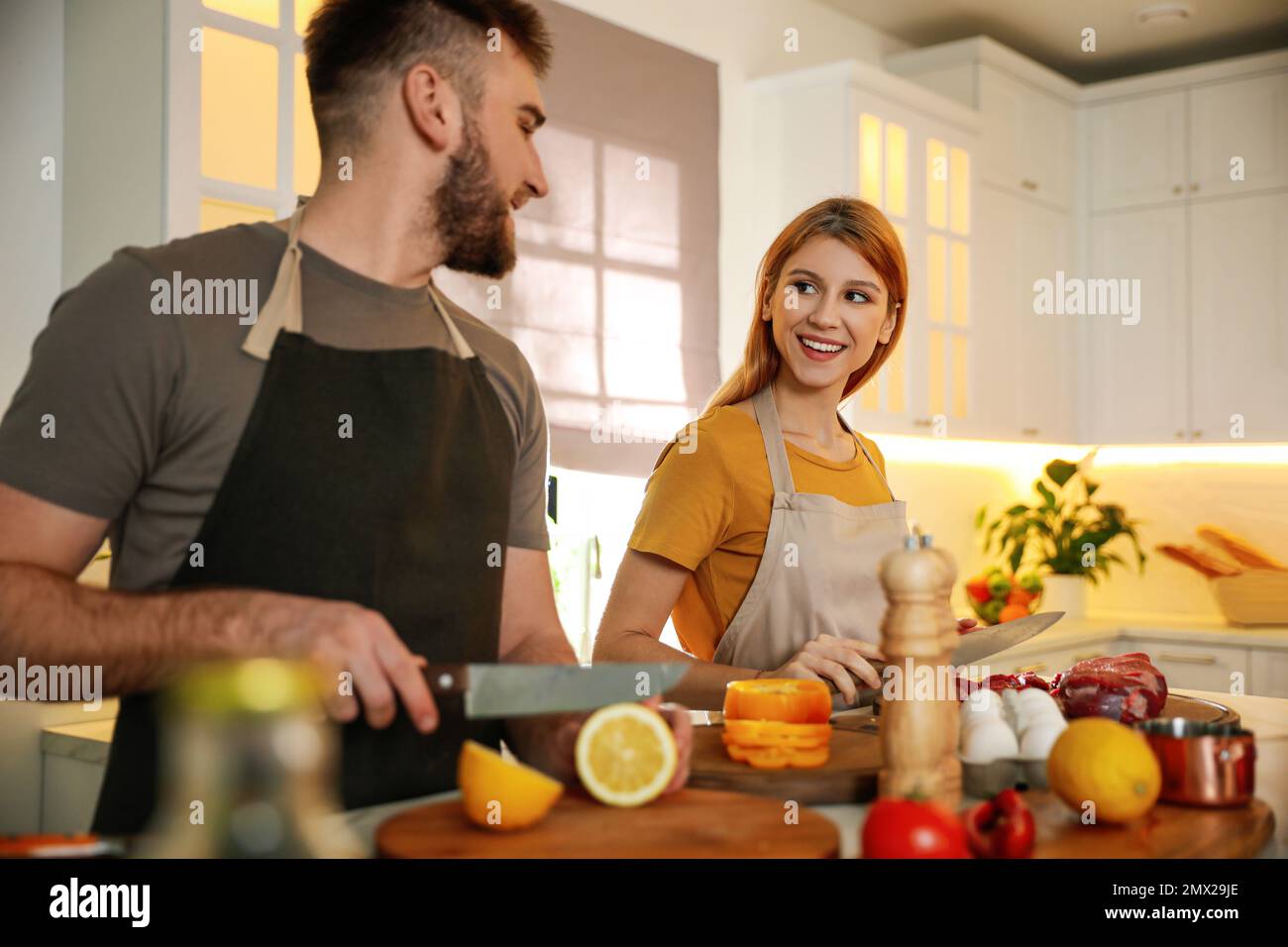 Happy people cooking food together in kitchen Stock Photo - Alamy