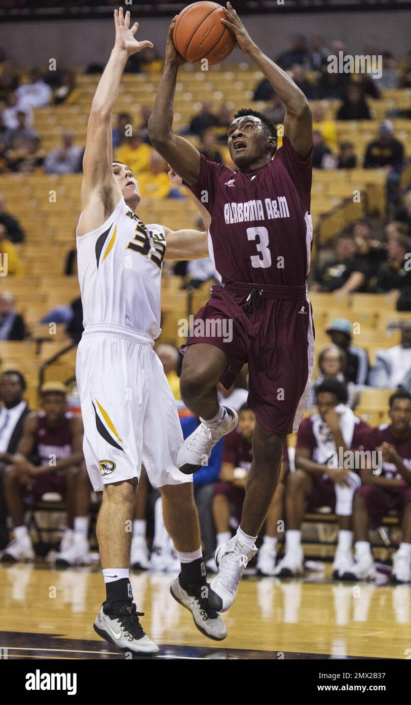 Alabama A&M's De'Edrick Petty, right, shoots over Missouri's Cullen ...