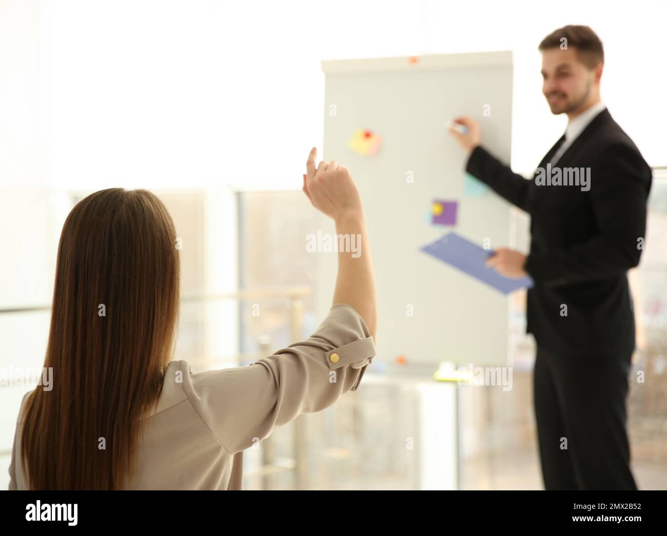 Woman raising finger question hi-res stock photography and images - Alamy
