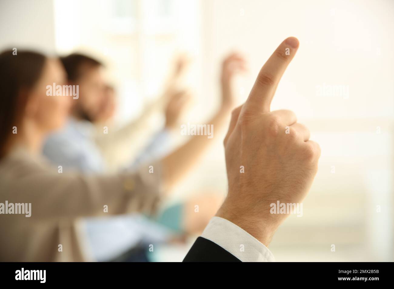 Woman raising finger question hi-res stock photography and images - Alamy