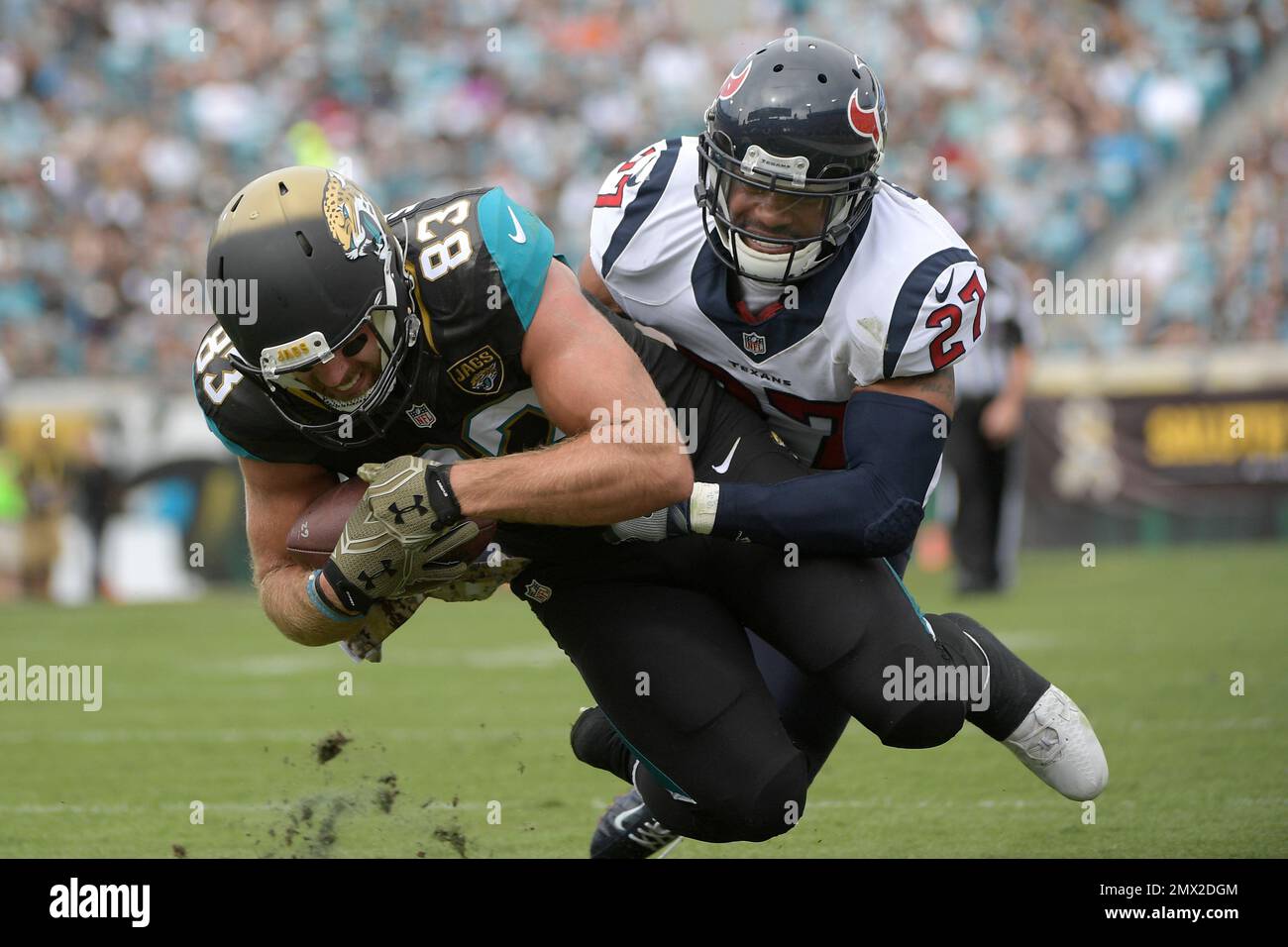 Jacksonville Jaguars tight end Ben Koyack (83) is tackled by Houston ...