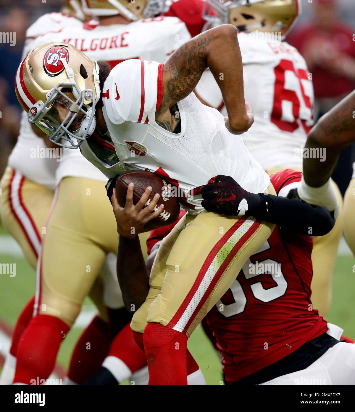 San Francisco 49ers quarterback Colin Kaepernick (7) is sacked by ...