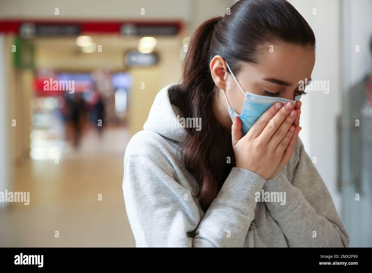 Woman wearing disposable mask hi-res stock photography and images - Alamy
