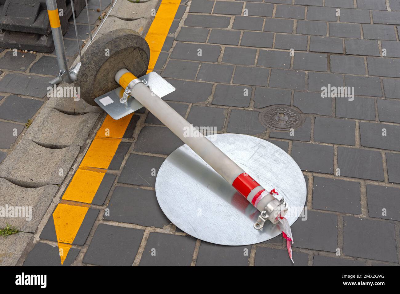 Temporary Road Sign Fall Down at Cobbled Street Stock Photo - Alamy