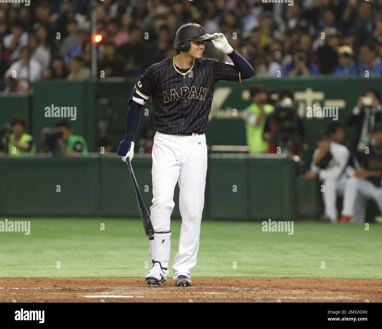 Japan’s Shohei Otani greets the umpire while coming to bat in the ...