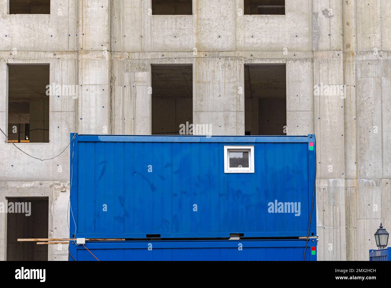 Stack Containers in Front of Concrete Building at Construction Site ...