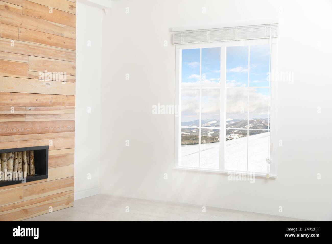Beautiful view of snowy mountains through big window Stock Photo - Alamy