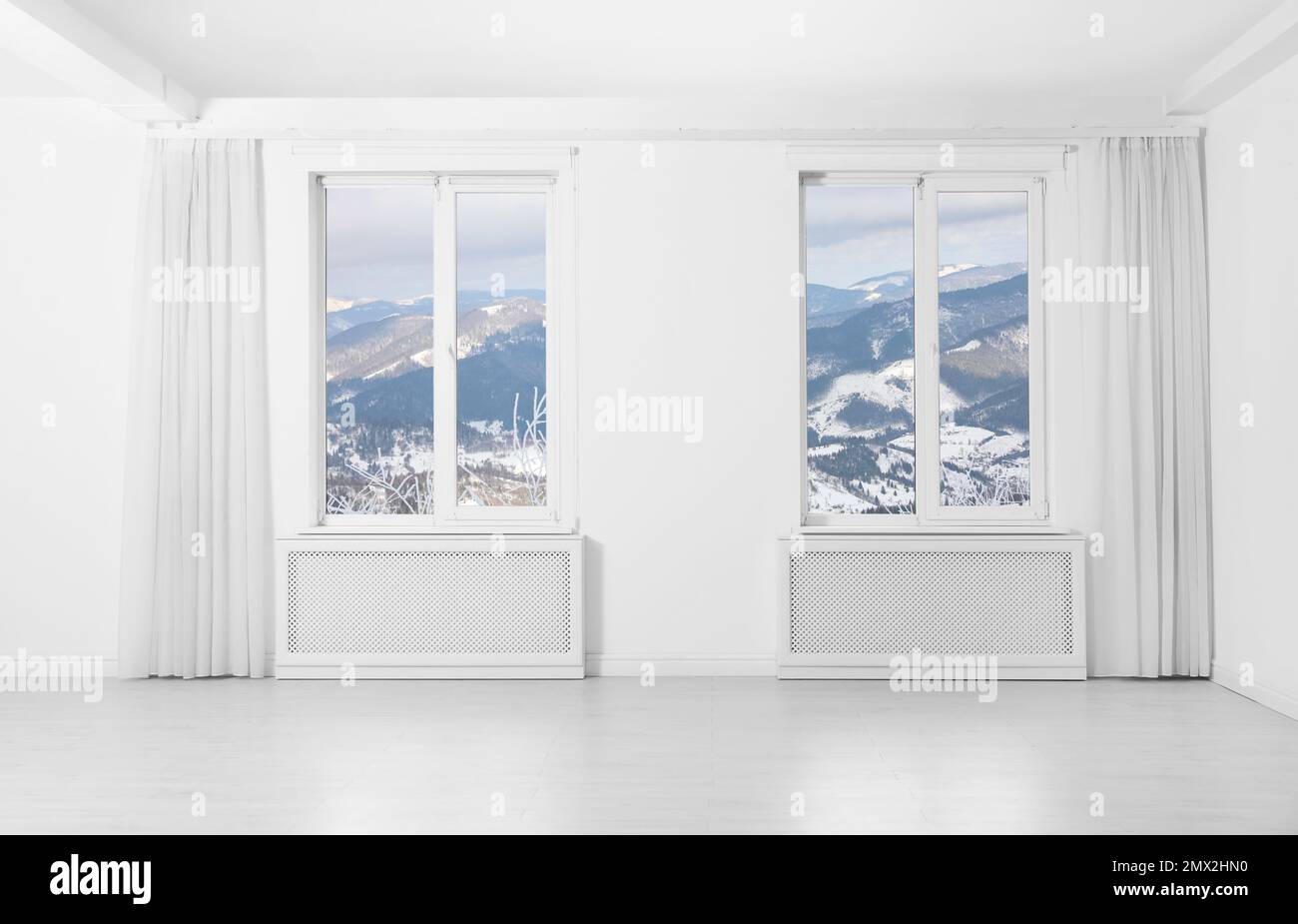 Beautiful view of snowy mountains through windows Stock Photo - Alamy