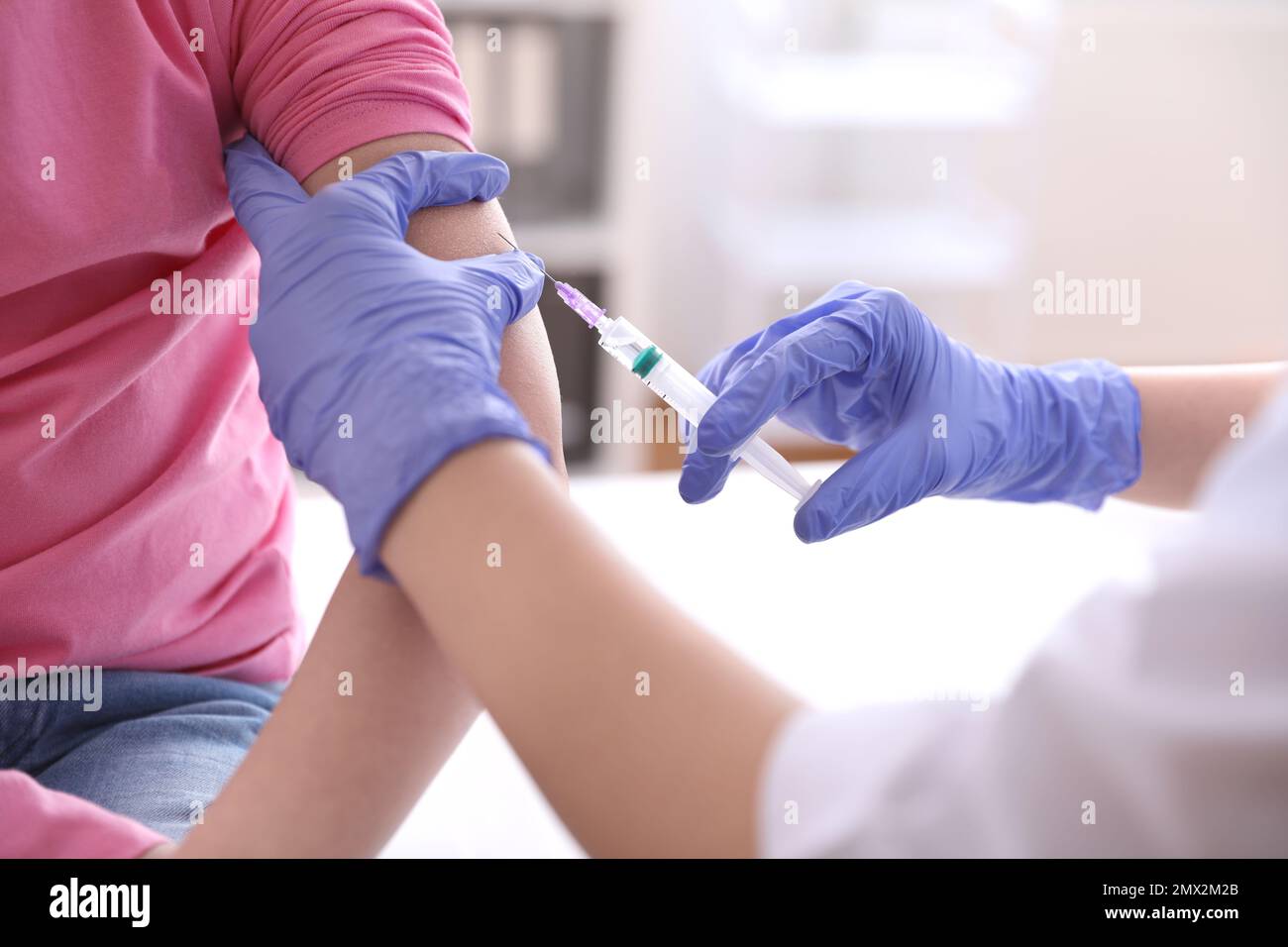 Little girl receiving chickenpox vaccination in clinic, closeup ...