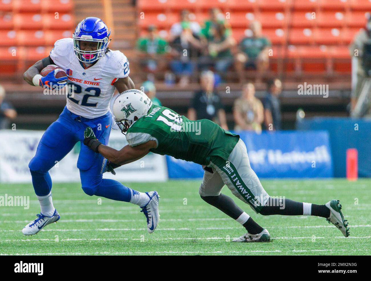 Boise State running back Alexander Mattison (22) is tackled by Hawaii ...