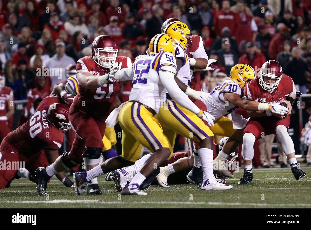 Arkansas' Austin Allen, right, is sacked by LSU's Duke Riley (40 ...