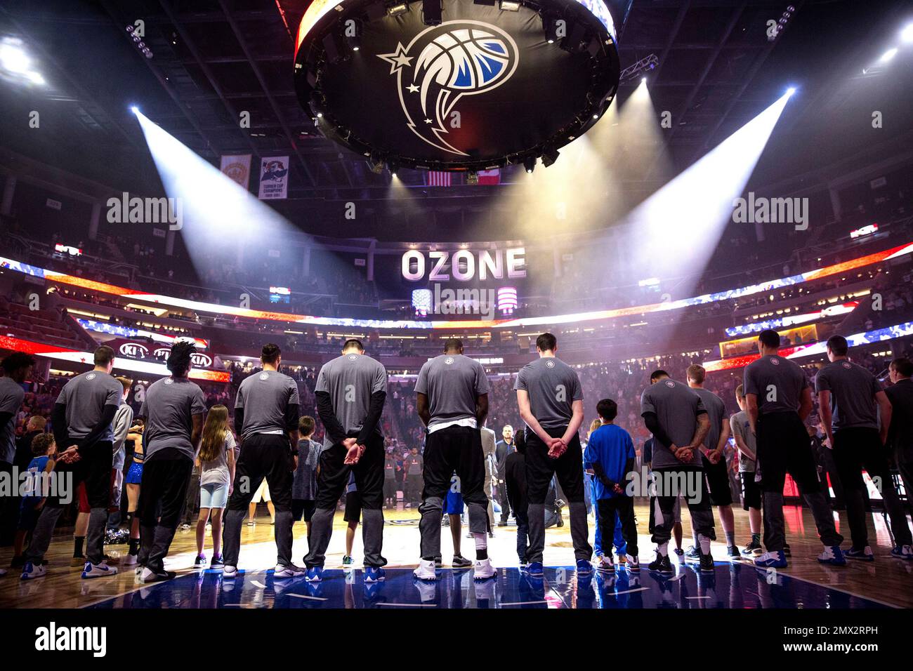 Orlando Magic basketball players stand for the opening ceremony during ...