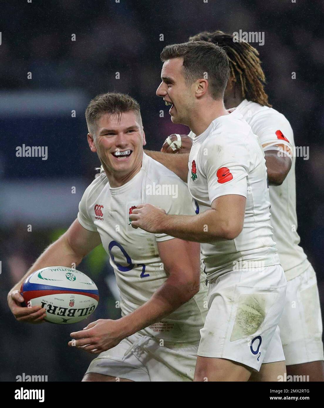 England's Owen Farrell, left, celebrates with George Ford, right, after ...