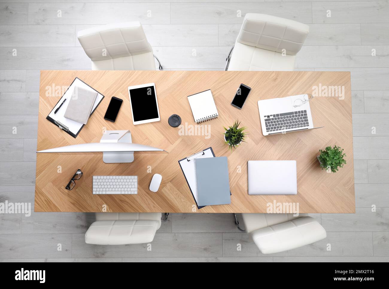 Modern office table with devices and chairs, top view Stock Photo - Alamy