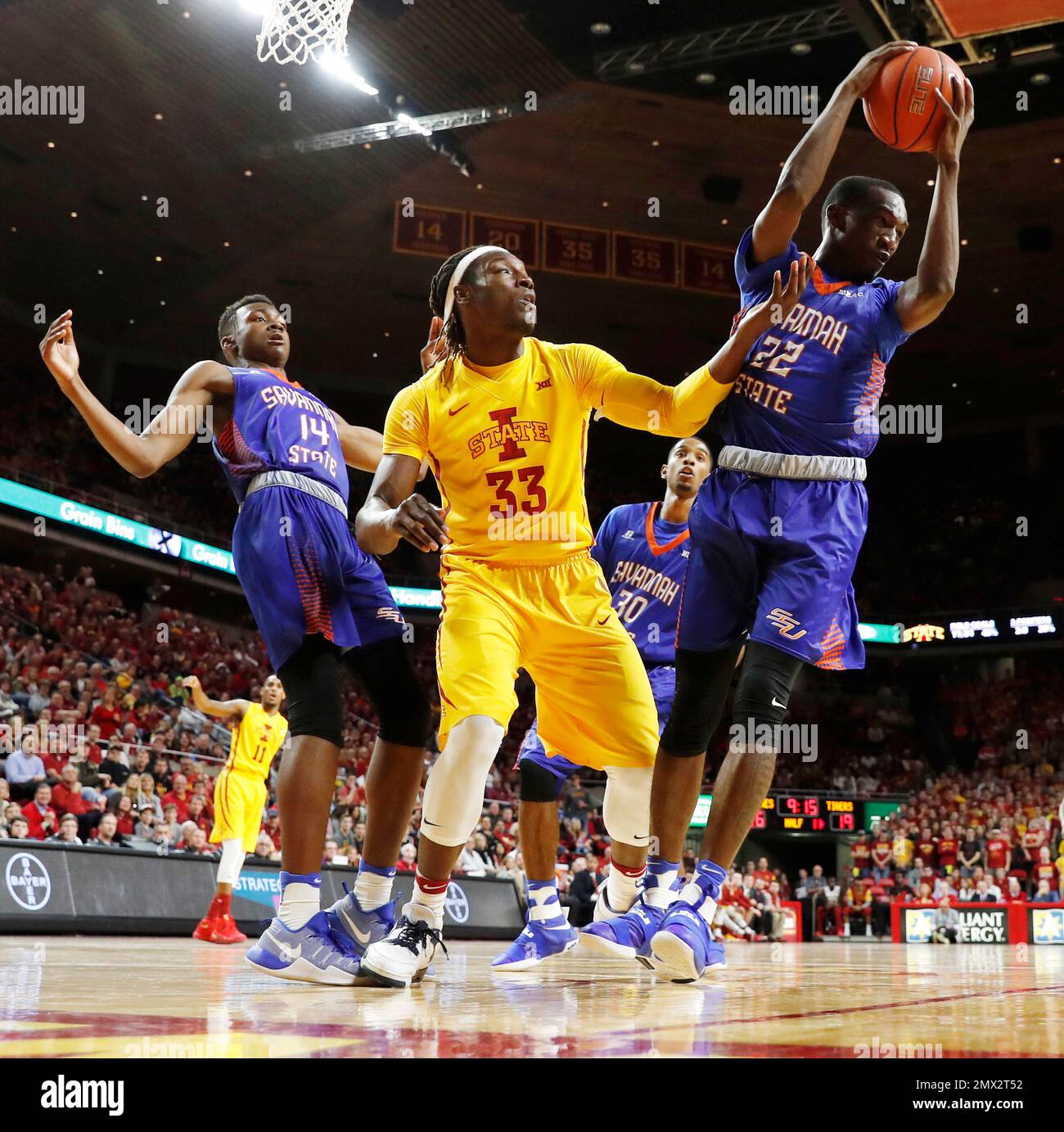 Iowa State forward Solomon Young (33) fights for a rebound with ...