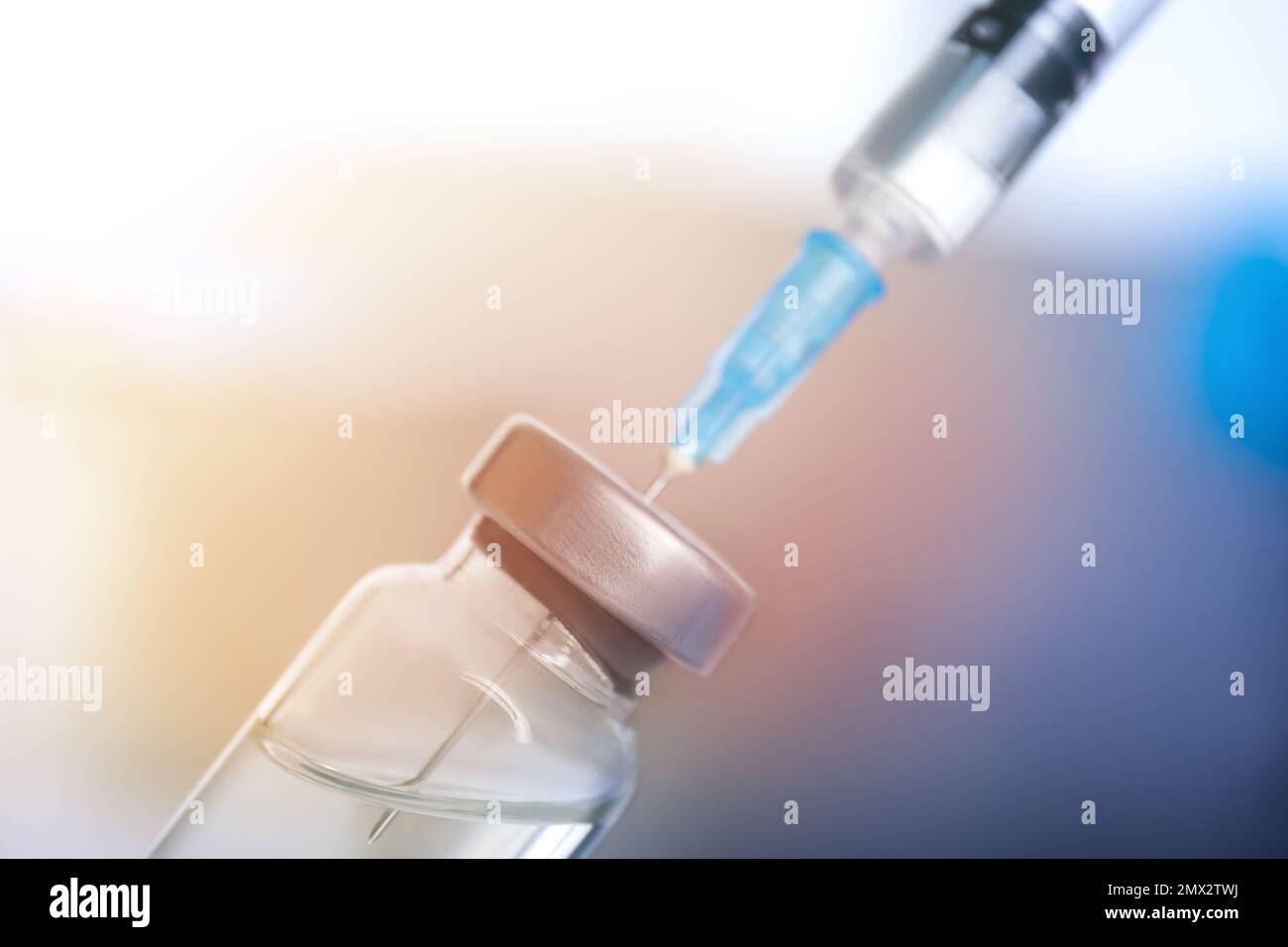 Vial and syringe on blurred background. Vaccination and immunization ...