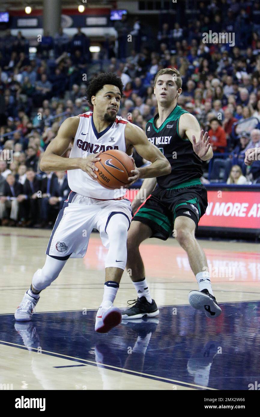 Gonzaga guard Silas Melson (0) drives the ball while defended by Utah ...