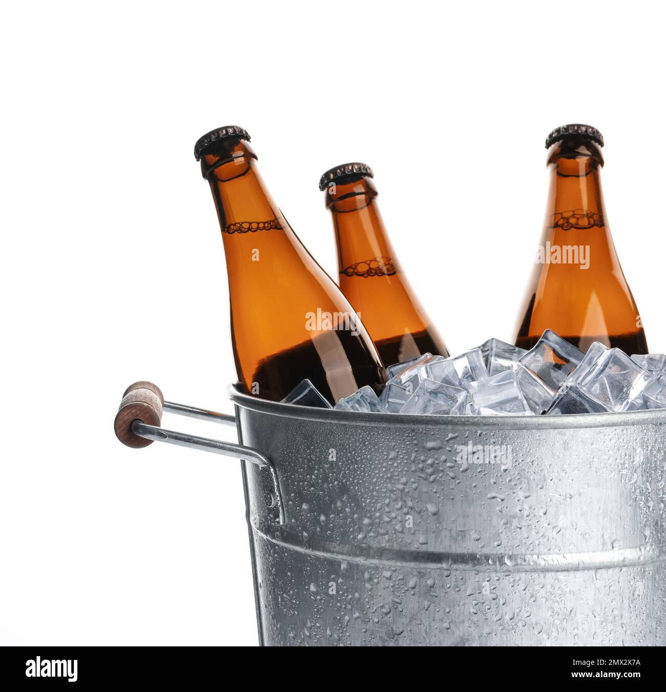 Metal bucket with bottles of beer and ice cubes isolated on white Stock ...