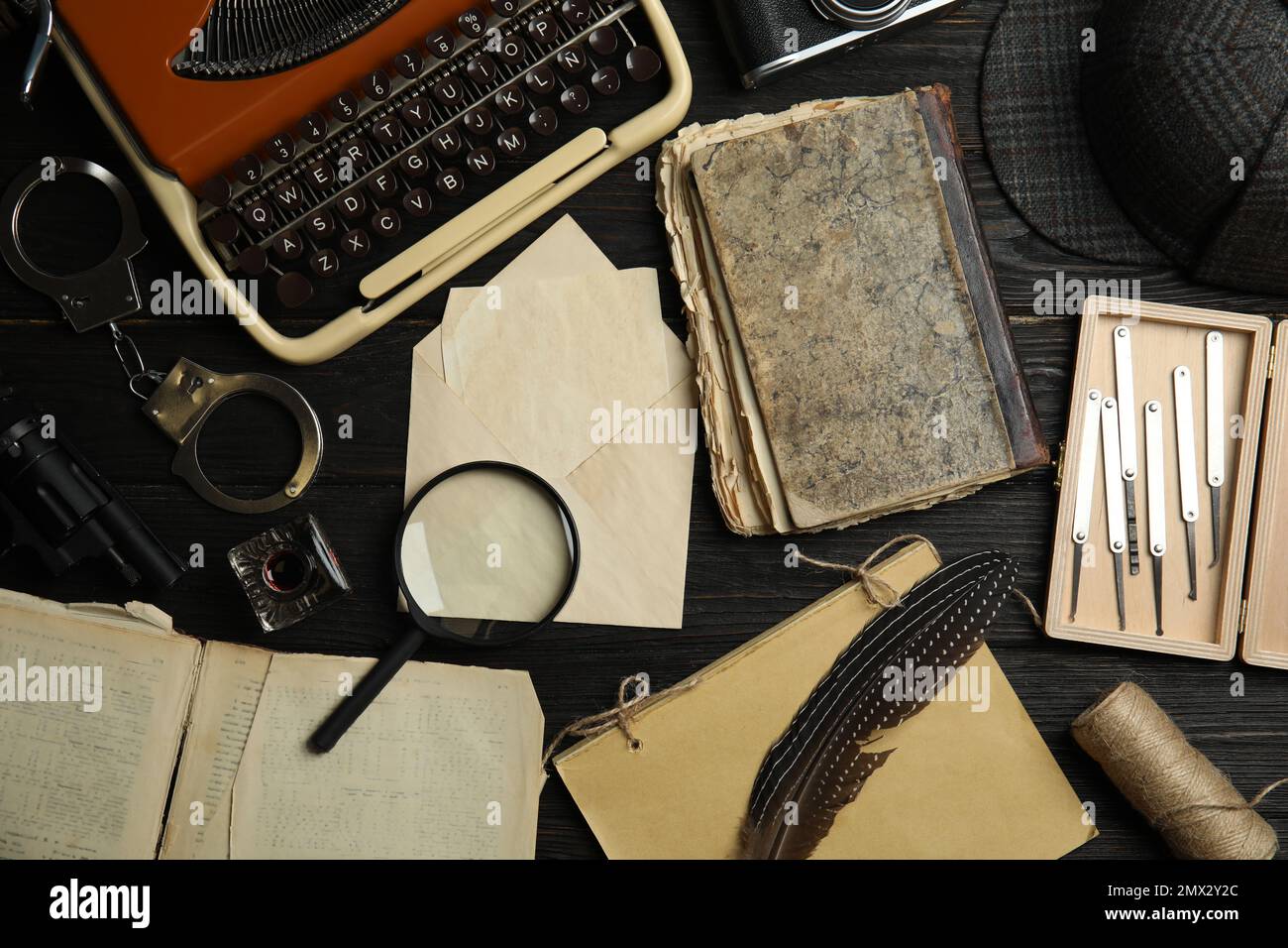 Composition with different vintage items on black wooden background ...