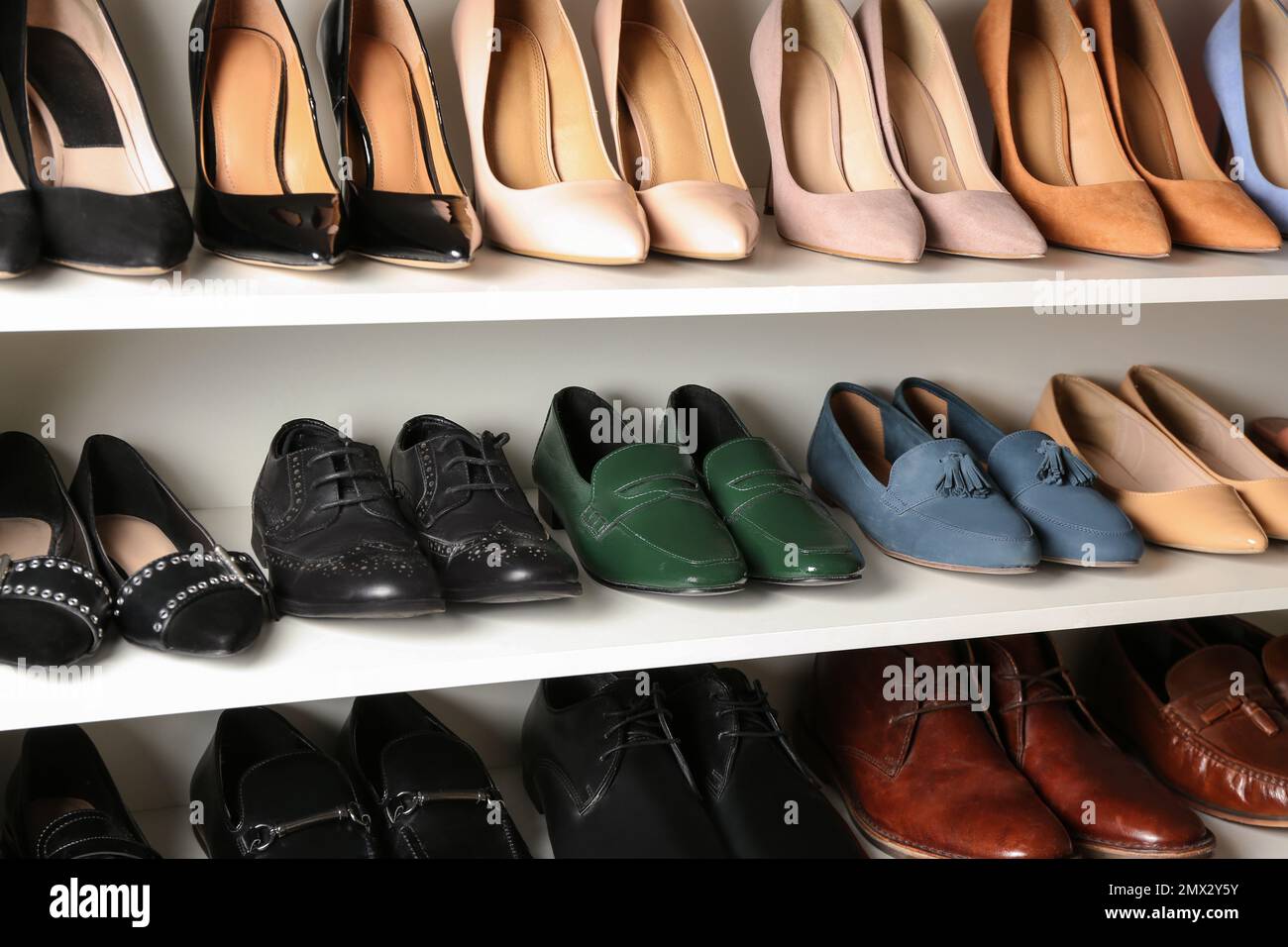 White shelving unit with different leather shoes Stock Photo - Alamy