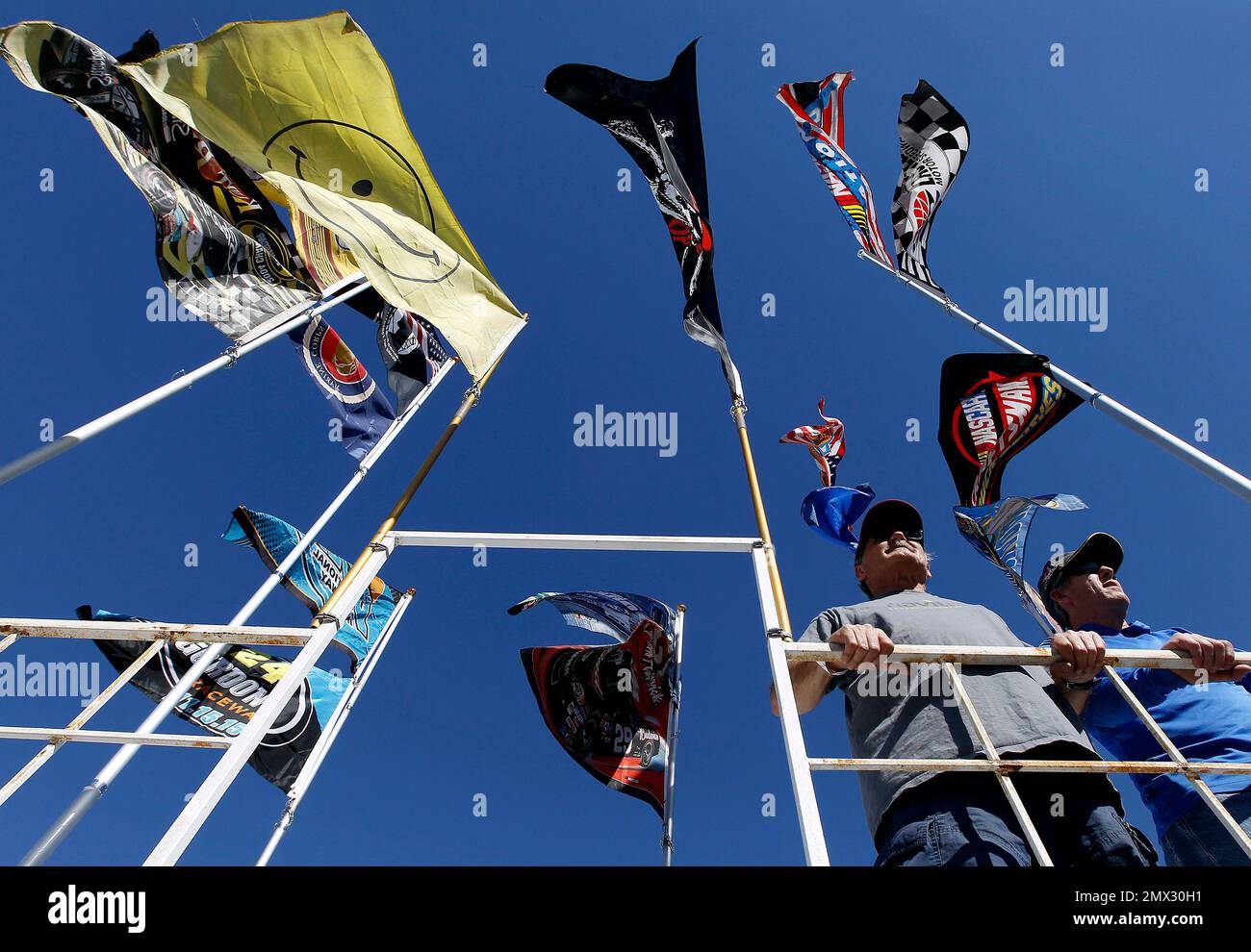 Fans Dan Schneider, left, and Marty Couch watch practice for the NASCAR ...
