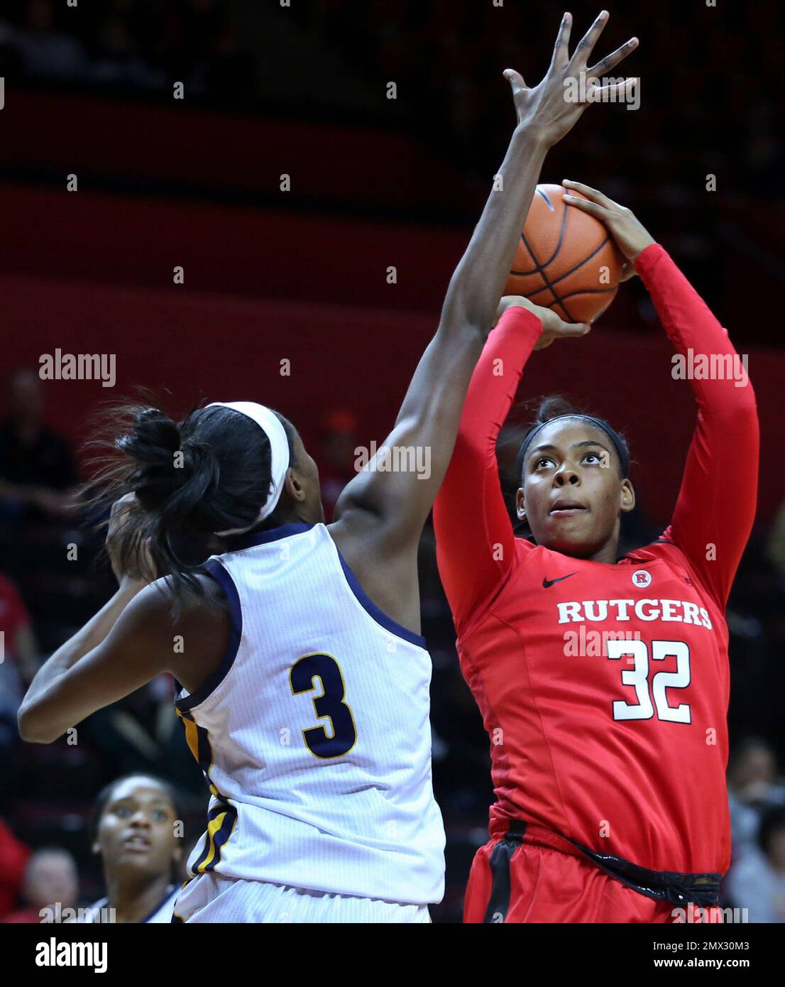 Rutgers center Desiree Keeling (32) takes a shot as Chattanooga forward ...