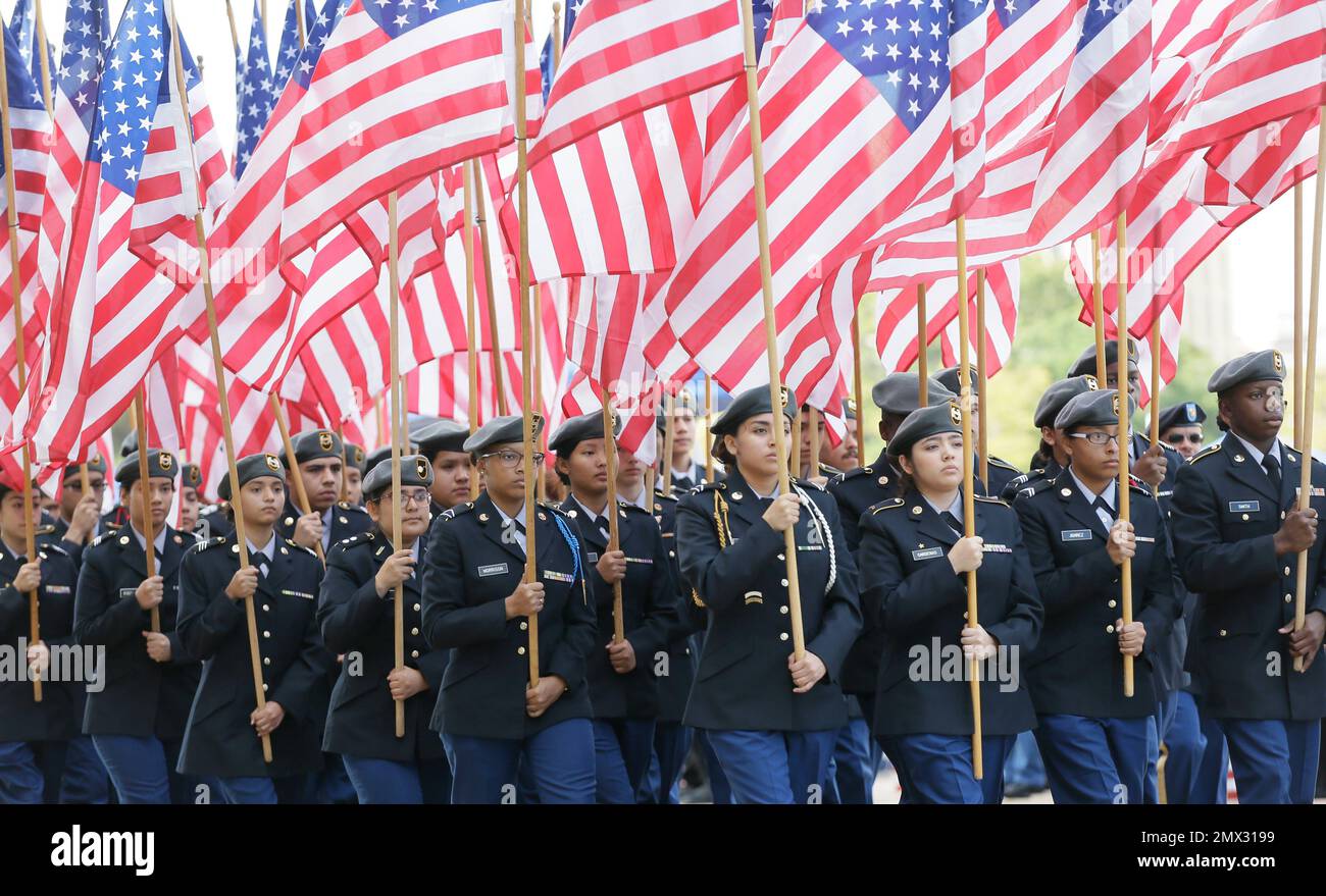 Irving High School ROTC members carry flags during a Veteran's Day ...