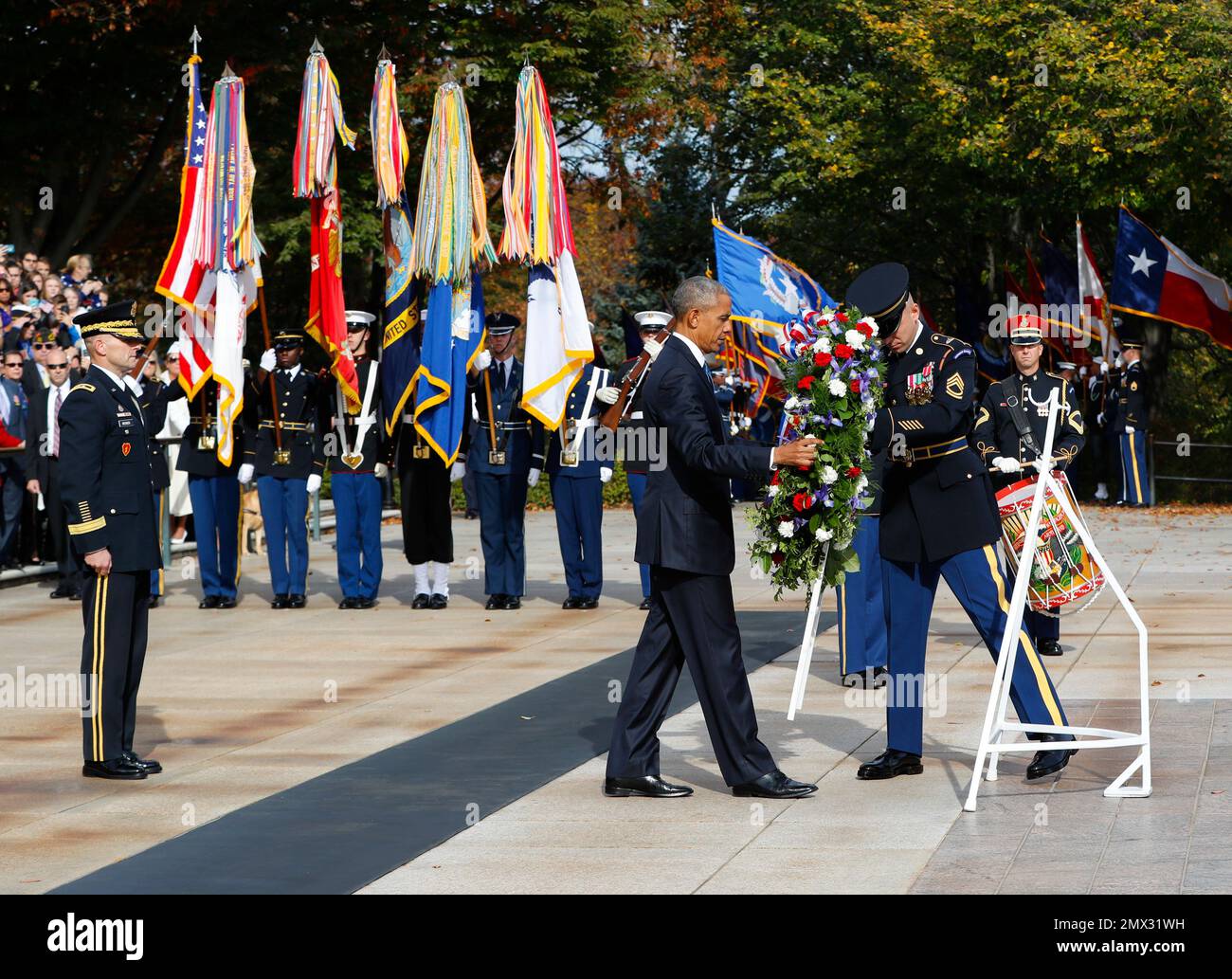 President Barack Obama lays a wreath at the Tomb of the Unknowns, on ...