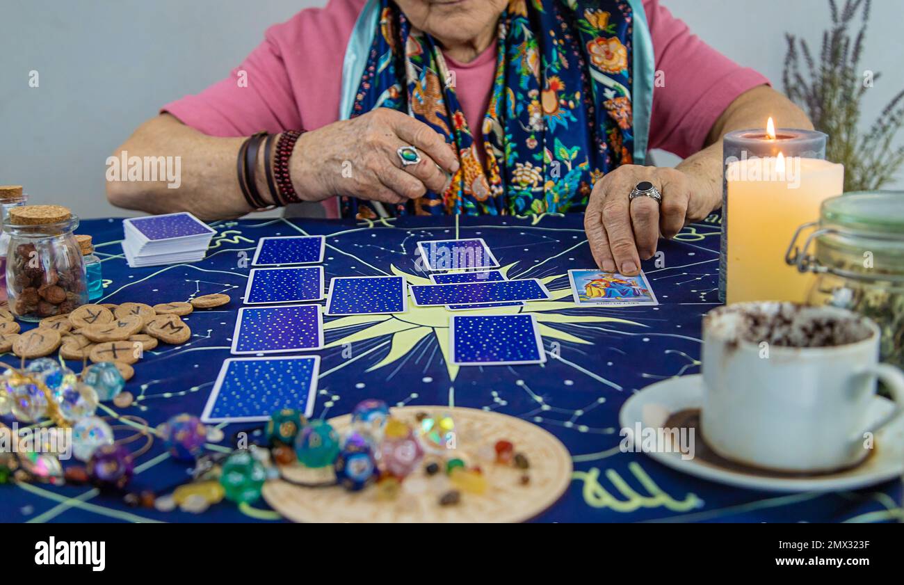 Fortune teller reads tarot cards. selective focus. Old Stock Photo - Alamy